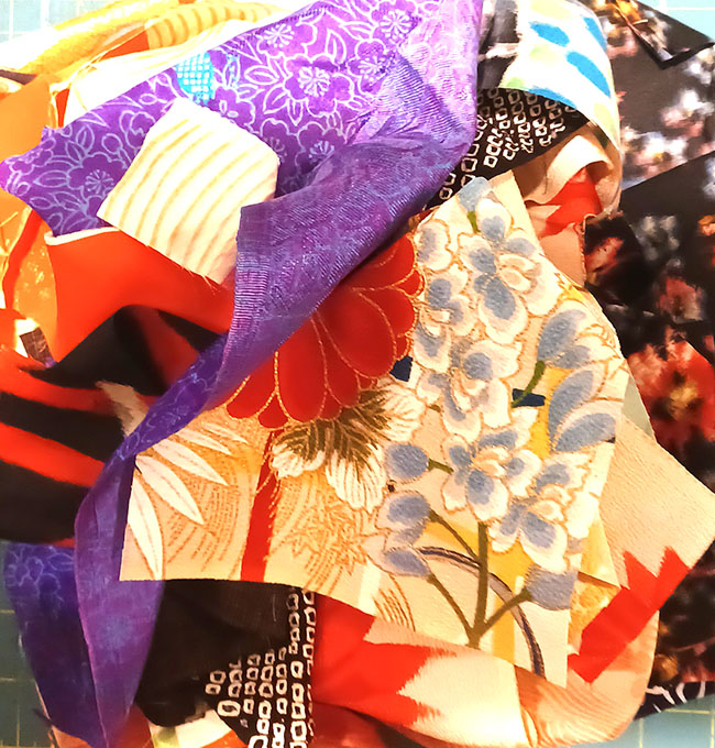 Kimoyes item: 28997 - Bag of many small mostly silk off-cuts.